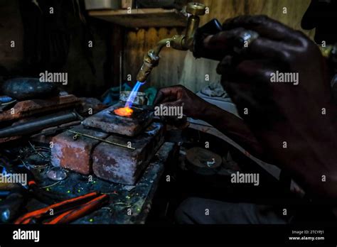 Samwel Mwangi Makes Jewelries At His Shop In Kibera Slum On October 25 2023 In Nairobi Kenya