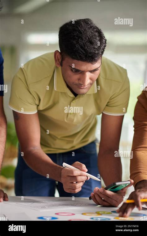 Serious Ux Designer Checking Usability Of New Mobile Application