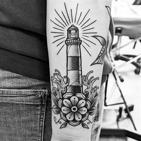Traditional Lighthouse Tattoo With Waves And Flower