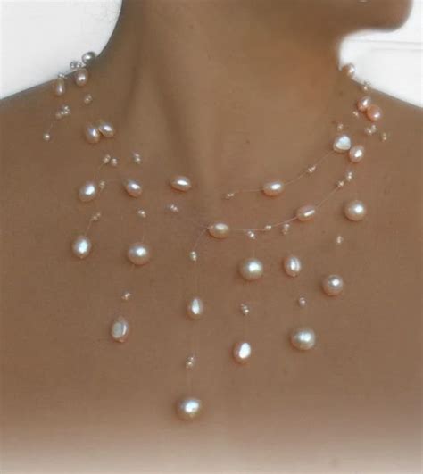 Pin By Jenny On Necklass Pearl Necklace Designs Hand Jewelry Bead