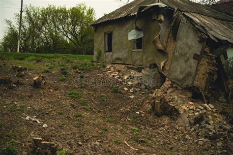 Dilapidated Rural Cottage On A Cloudy Day With Overgrown Vegetation Abandoned House Falling
