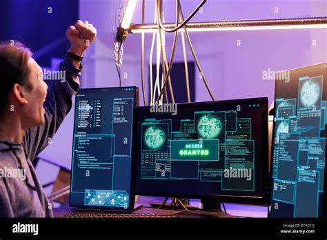 hacker celebrating access granted to computer system and doing illegal