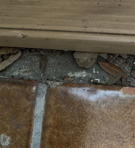 Concrete Horizontal Gap Between Where The Tile Ends And The Door