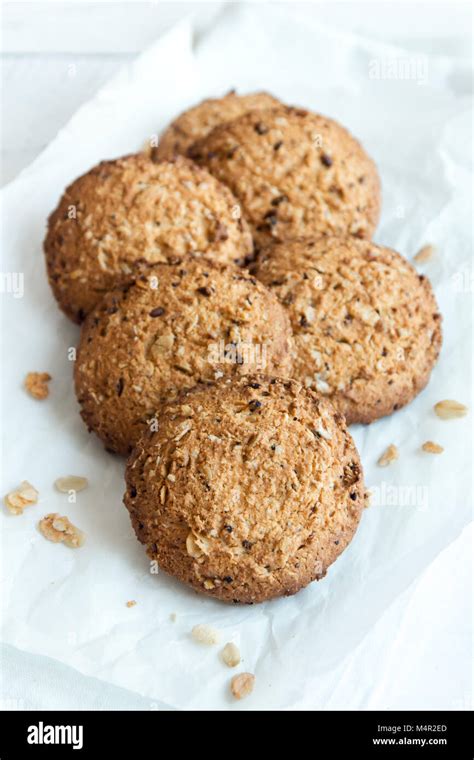 Homemade Oatmeal Cookies With Flax And Sesame Seeds On White Wooden