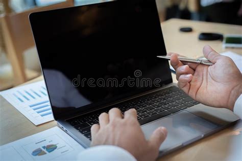 A Financial Businessman A Young Man Analyzes Financial Data Using A