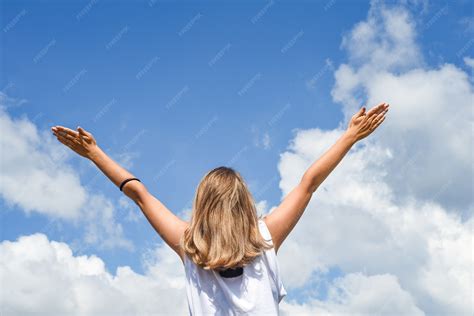 Girl Reaching Up To The Sky