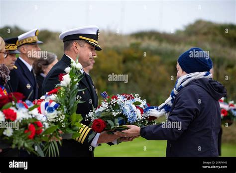 Capt Gary M Chase Commanding Officer Uss Normandy Receives A Wreath