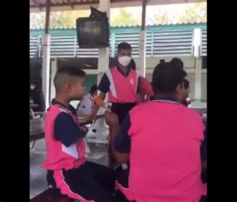 Kind Student Earns Praises For Feeding His Armless Classmate