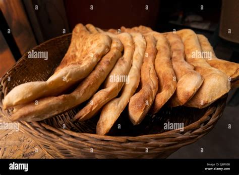 Stack Of Delicious Traditional Georgian Shoti Bread In A Wicker Basket