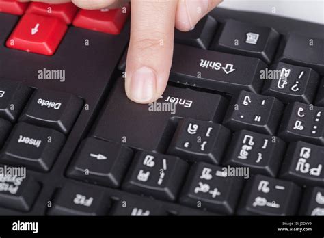 Finger Pushing Enter Button On A Keyboard Of Computer Stock Photo Alamy