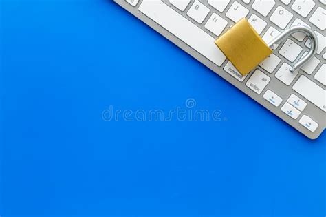 computer system protection from hacker with locker and keyboard on blue