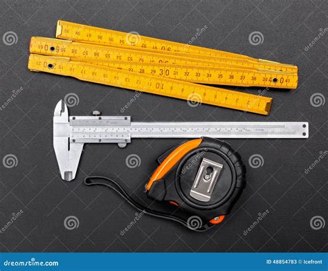 Measuring Tools On Black Ruler Caliper And Tape Stock Image Image Of Measuring Metric 48854783