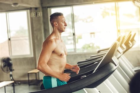 Premium Photo Shirtless Man Exercising On Treadmill