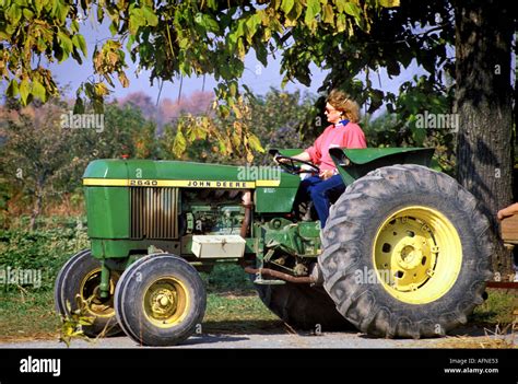 Female Farmer Drive A Tractor Stock Photo Alamy