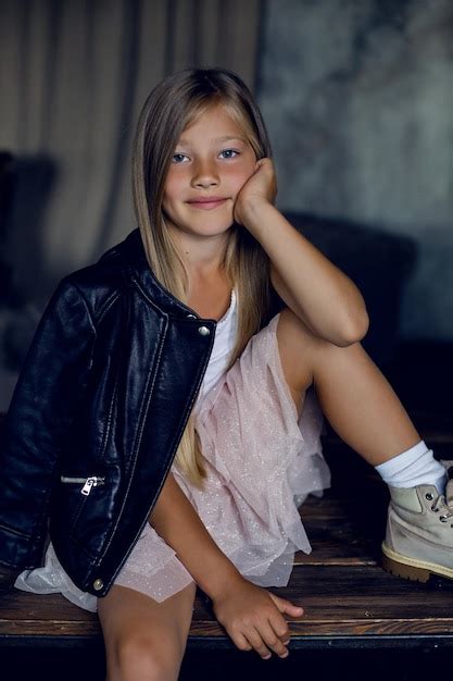 Premium Photo Fashionable Girl Model In A Leather Jacket Skirt And