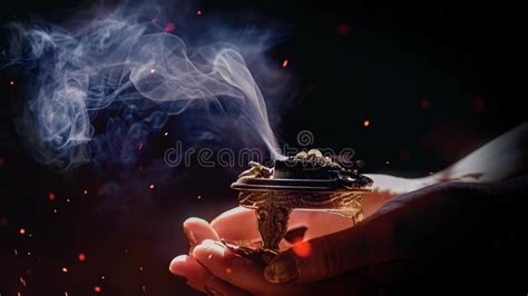 Incense In A Woman Hand Incense Smoke On A Black Background Stock