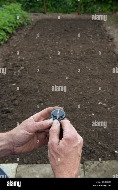 Planning A Plot Using Compass To Work Out Direction The Plot Faces