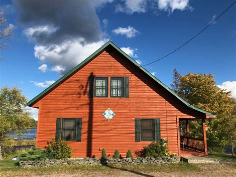 Red House With Green Trim And Windows