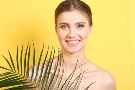 Portrait Of A Beautiful Young Girl With Nude Makeup On A Colored