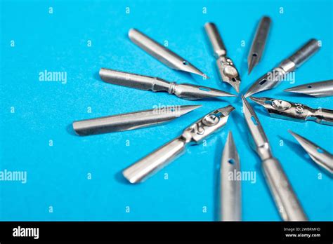 Multiple Vintage Pen Nibs Pointing To The Same Direction Teamwork Concept Soft Focus Stock