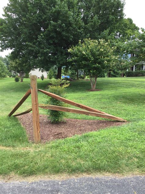 Rustic Wooden Gate In A Grassy Area Landscaping Around Power Pole
