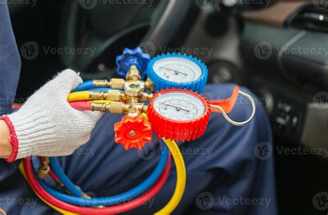 Repairman holding monitor tool to check and fixed car air conditioner system, Technician check ...