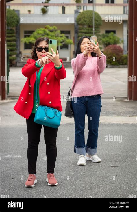 Two Vietnamese Women Tourists Take Selfies In Mong Cai Vietnam On The