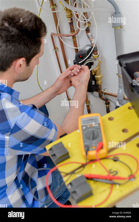Man Connecting Cables Stock Photo Alamy