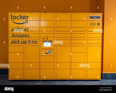 Orange Amazon Secure Lockers Of Various Sizes Located In A Shopping