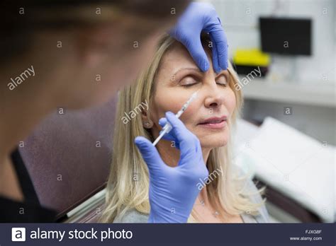 Technician Giving Woman Botox Injection Side Of Nose Stock Photo Alamy