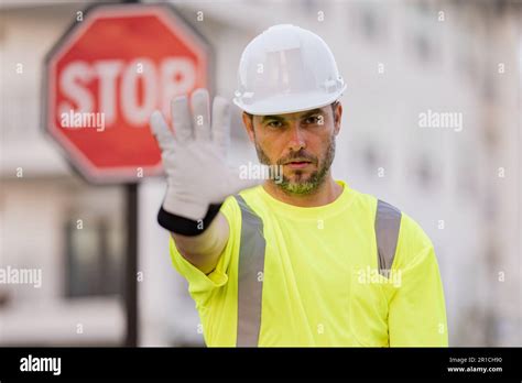 Serious Engineer With Stop Road Sign Builder With Stop Gesture No Hand Dangerous On Building