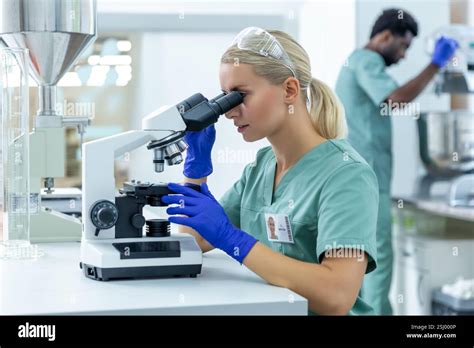 Woman Researcher Performing Chemistry Tests In Scientific Laboratory