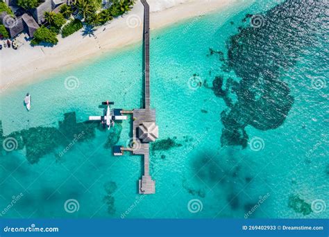 Beautiful Aerial View Of Maldives Shore Jetty Villa Seaplane Top View