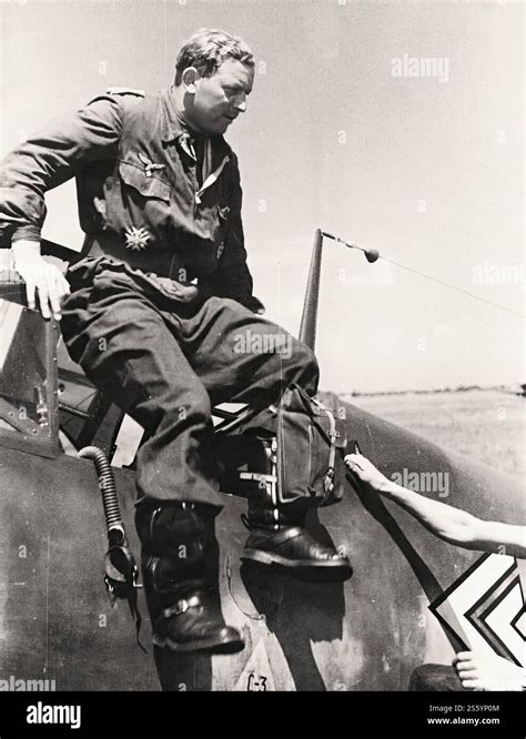 Hauptmann Walter Oesau (III.JG3 CO) out of the cockpit of his fighter ...