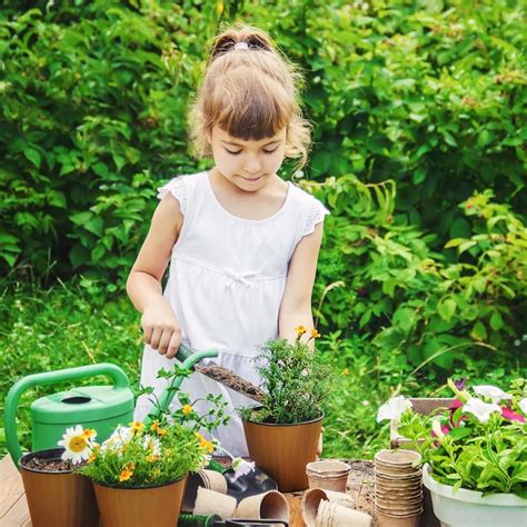Premium Photo Portrait Of Young Woman Picking Plants