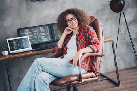 Young Female Coder Working Remotely With A Relaxed And Confident
