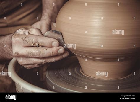 Elderly Man Making Pot Using Pottery Wheel In Studio Stock Photo Alamy