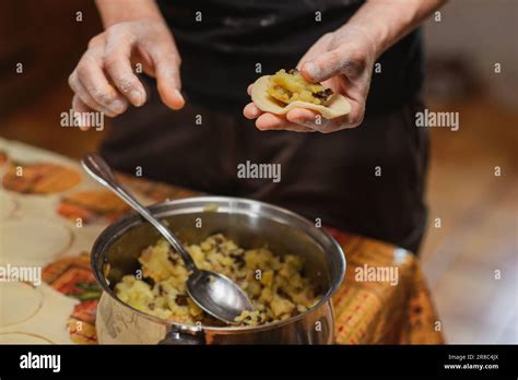 Preparation Of Varines Unrecognizable Woman Puts Filling In Dough