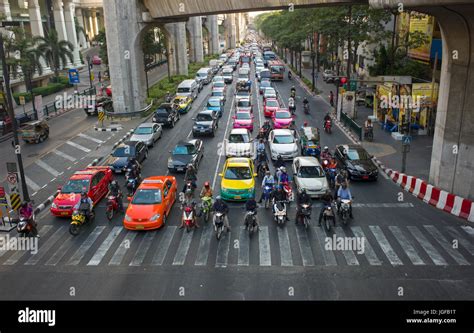 Traffic In Queue Waiting For Green Traffic Light At Road Junction Bts