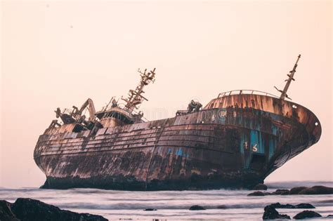 Beautiful Shot Of A Historic Dirty Old Ship After A Shipwreck On A Seashore Stock Photo Image