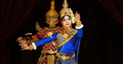 Woman Wearing Traditional Costume Next To Buddha Sculpture · Free Stock