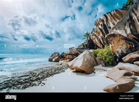 Picturesque Granite Boulders Formation On Tropical White Sand Beach