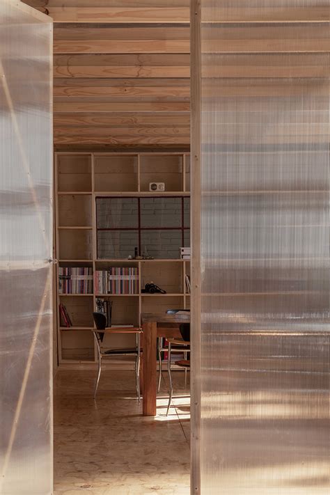 Polycarbonate Panels Reflect Light Within Minimalist Atelier Industrial In Argentina