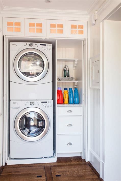 Hidden Laundry Closet With Stackable Front Loading Washer And Dryer And