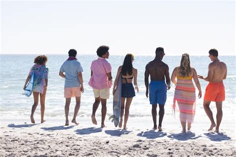 Premium Photo A Diverse Group Of Friends Enjoys A Day At The Beach