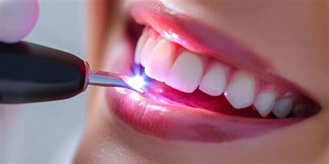 A Woman Receiving Laser Gum Treatments Is Shown In Closeup Against A