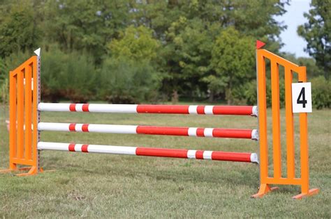 Premium Photo Built Structure On Field Against Trees