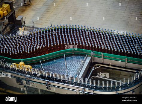 Modern Automated Beer Bottling Production Line Beer Bottles Moving On Conveyor Stock Photo Alamy
