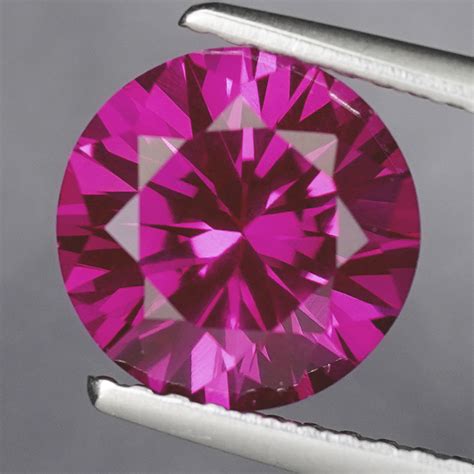 2ct 8mm Round Brilliant Cut Synthetic Ruby Rainbow Sapphire™