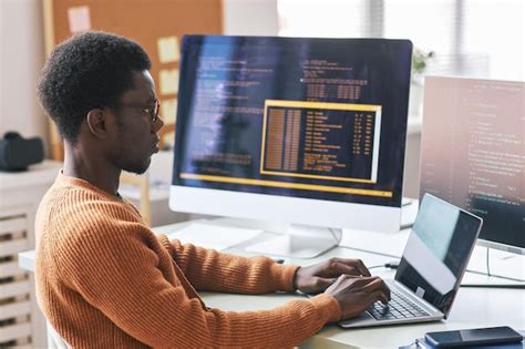 Premium Photo Serious Young Black Man In Warm Orange Sweater